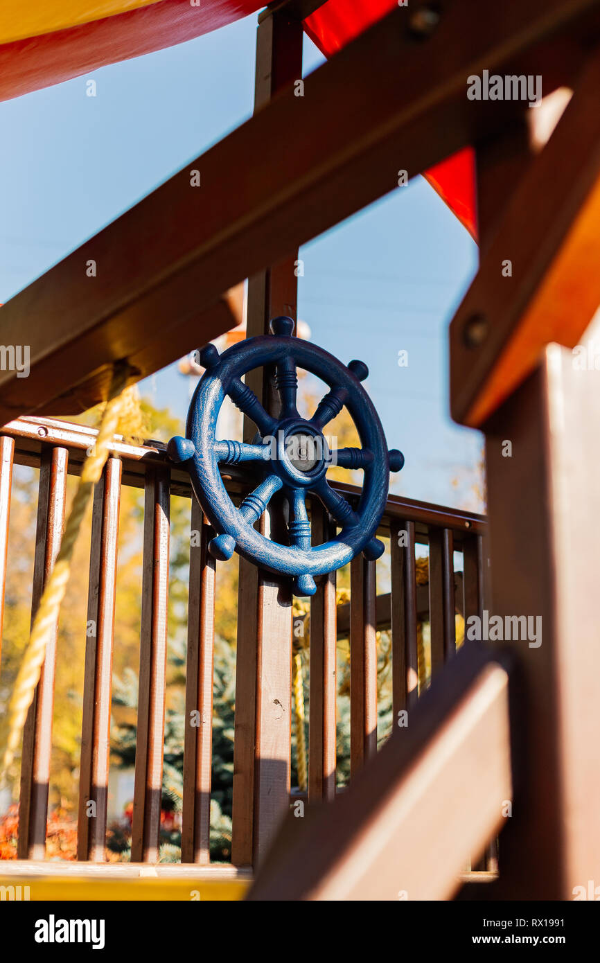 Blue wheel on the playground, exciting game Stock Photo - Alamy