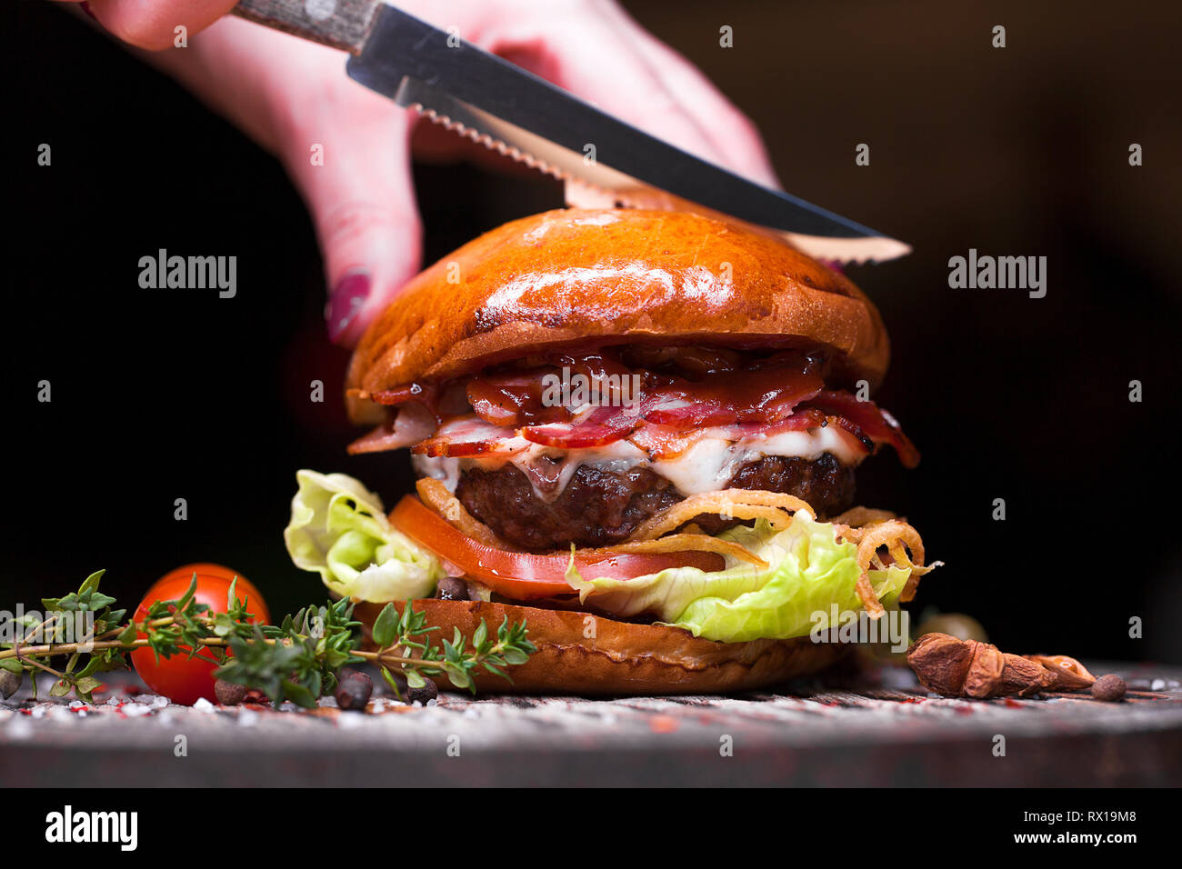 Fast food closeup with traditional tasty hamburger Stock Photo - Alamy