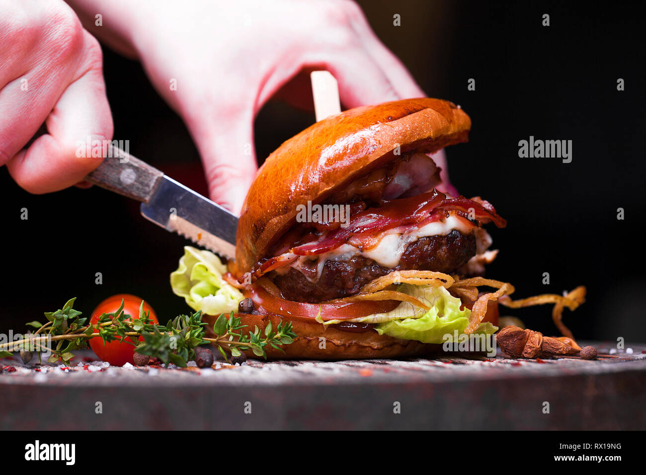 Fast food closeup with traditional tasty hamburger Stock Photo - Alamy