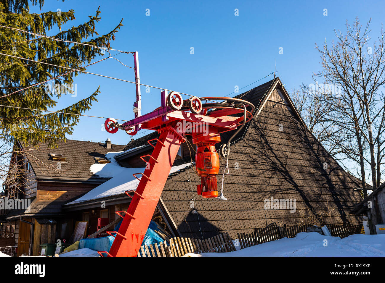 The mechanism of the ski lift, visible large, driving wheel pulling a ...