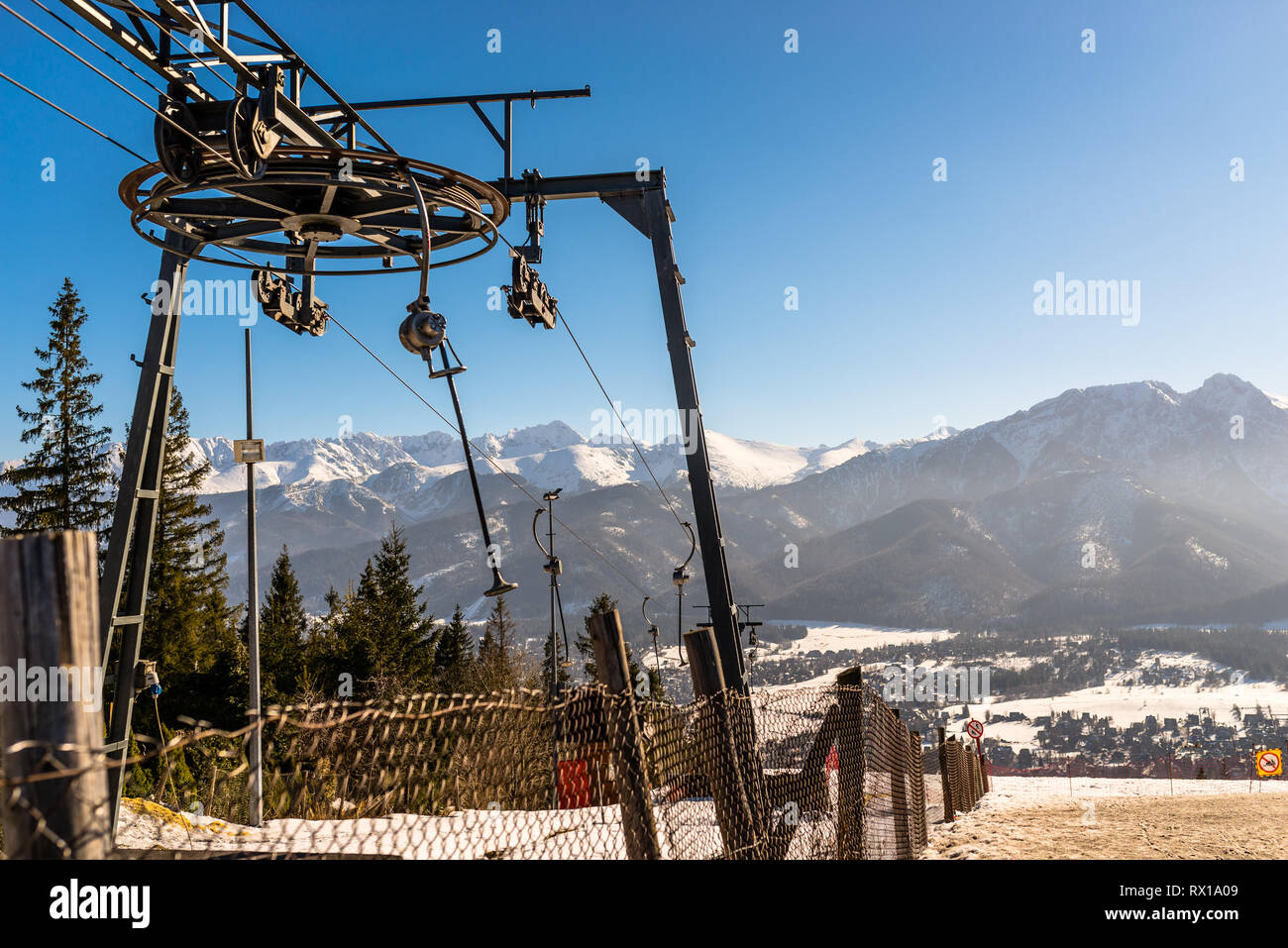 The mechanism of the ski lift, visible large, driving wheel pulling the ...