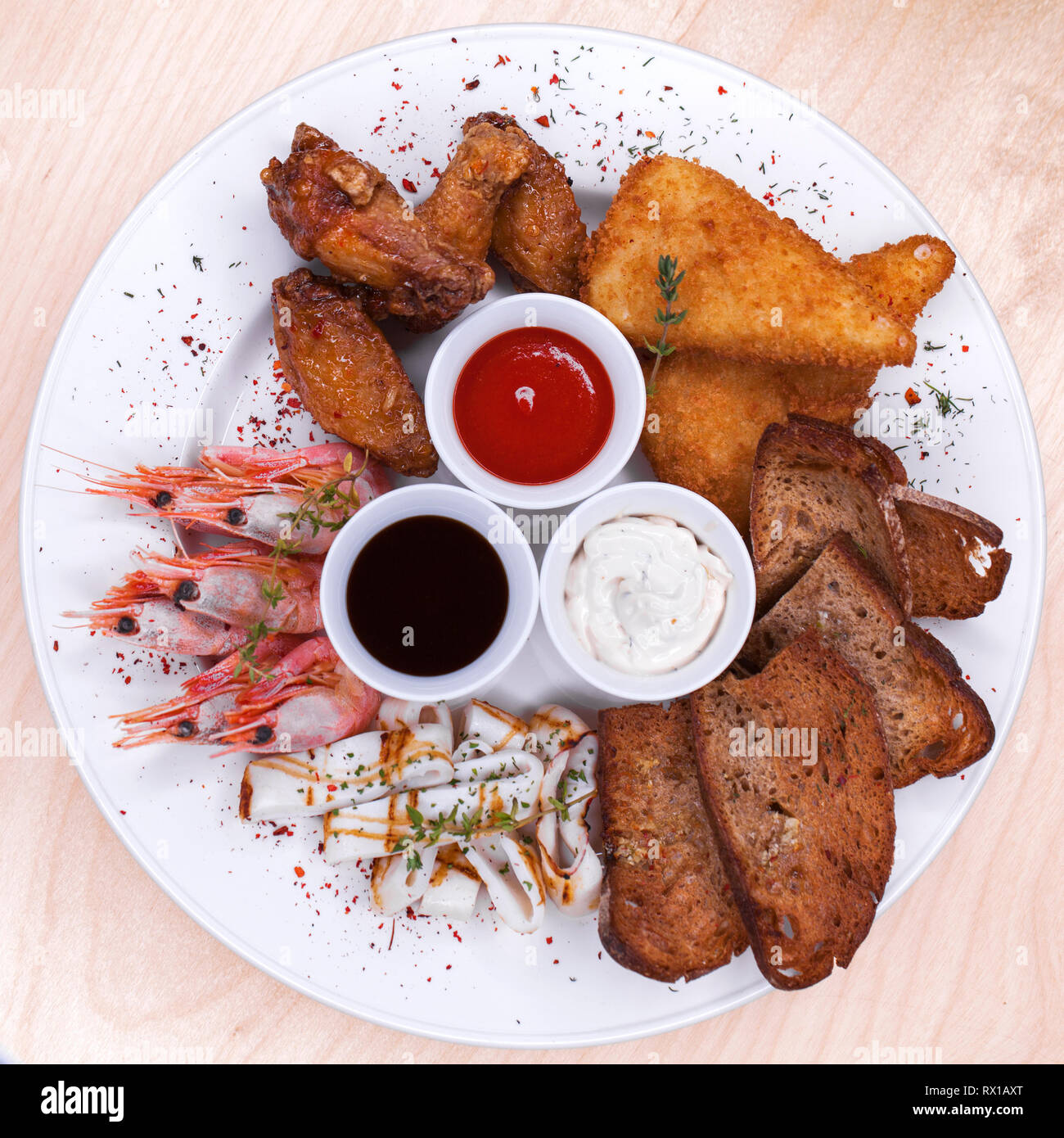 Restaurant dish. Plate of assorted beer snacks, lard, boiled shrimps ...