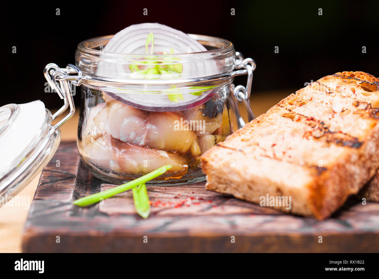 Restaurant dish - Marinated mackerel in a glass jar - snack under vodka ...
