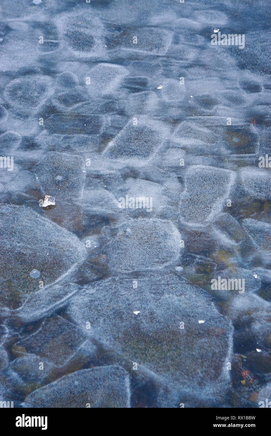 Ice plates on a lake as a background Stock Photo - Alamy
