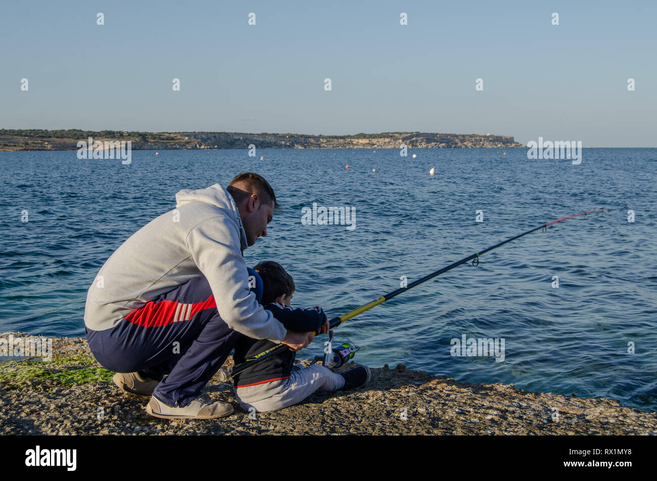 Father and son fishing on the sea doc - bounding concept Stock Photo ...