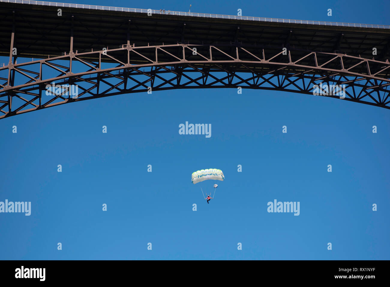 Miles Daisher, professional base jumper, jumping from the Perrine ...