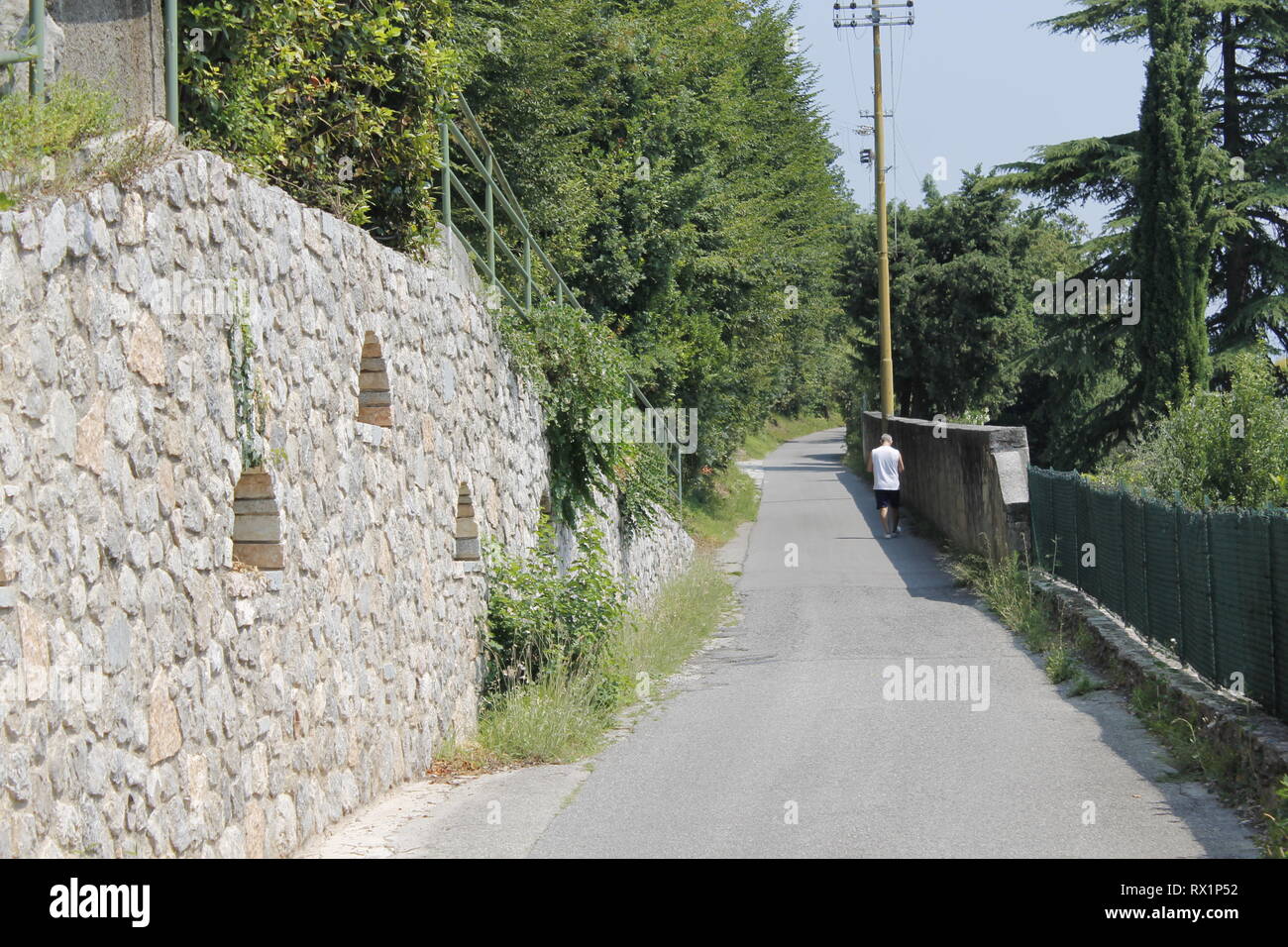 road with ancient wall in north Italy Stock Photo - Alamy