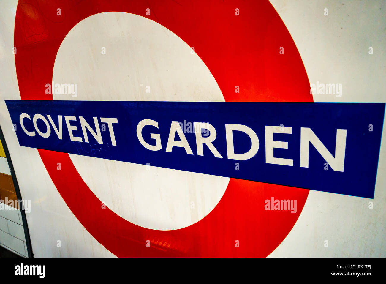 Iconic circular London Tube sign on the underground platform at Covent ...
