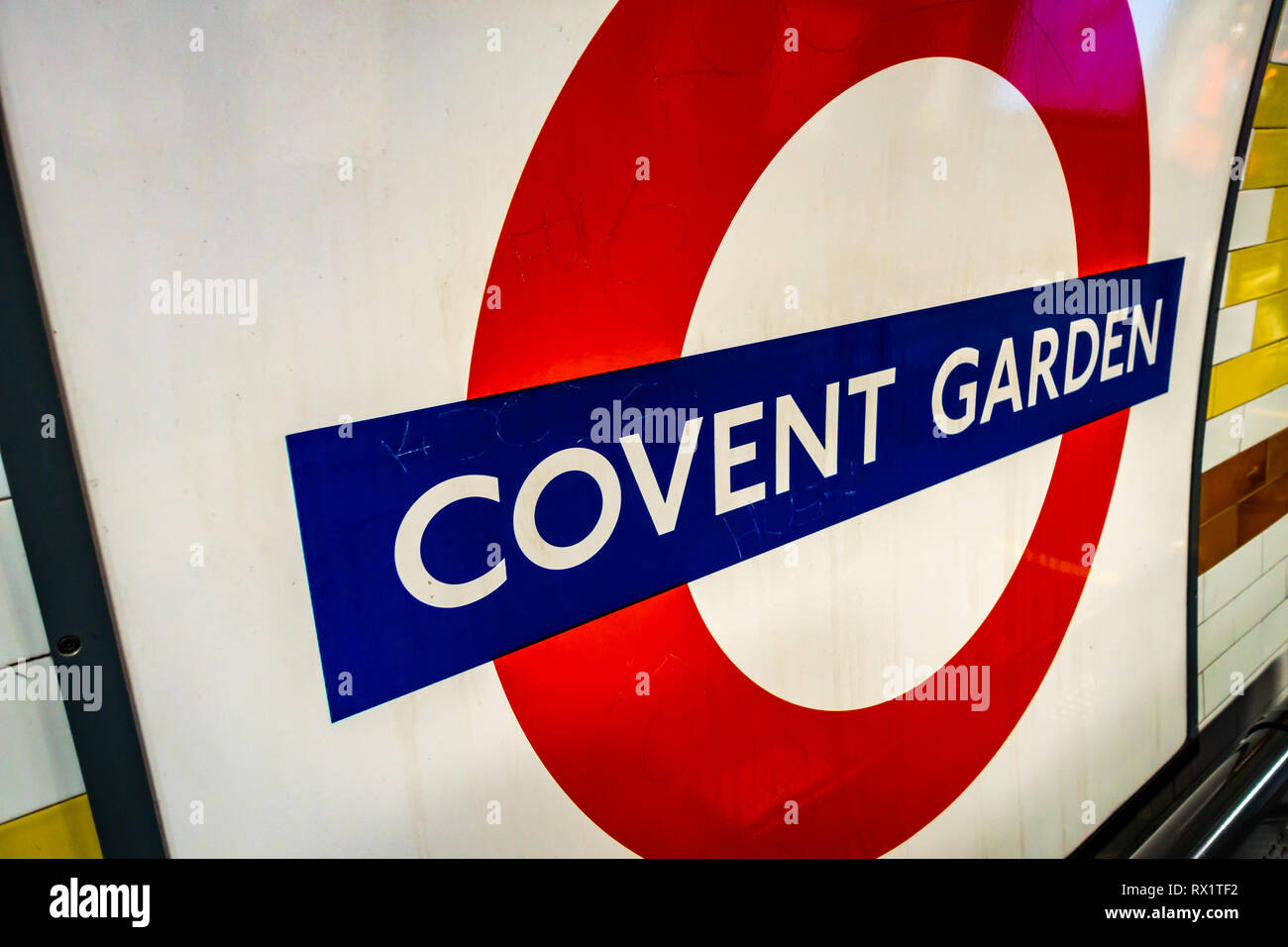 Iconic circular London Tube sign on the underground platform at Covent ...
