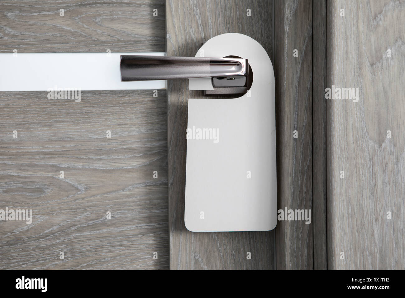 Hotel door handle with blank paper hanger Stock Photo - Alamy