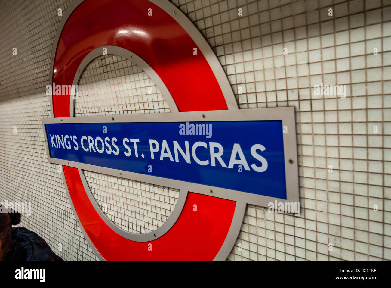 Iconic circular London Tube sign on the underground platform at Kings ...