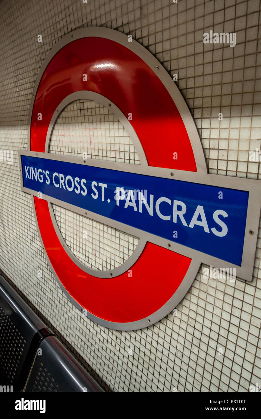 Iconic circular London Tube sign on the underground platform at Kings ...