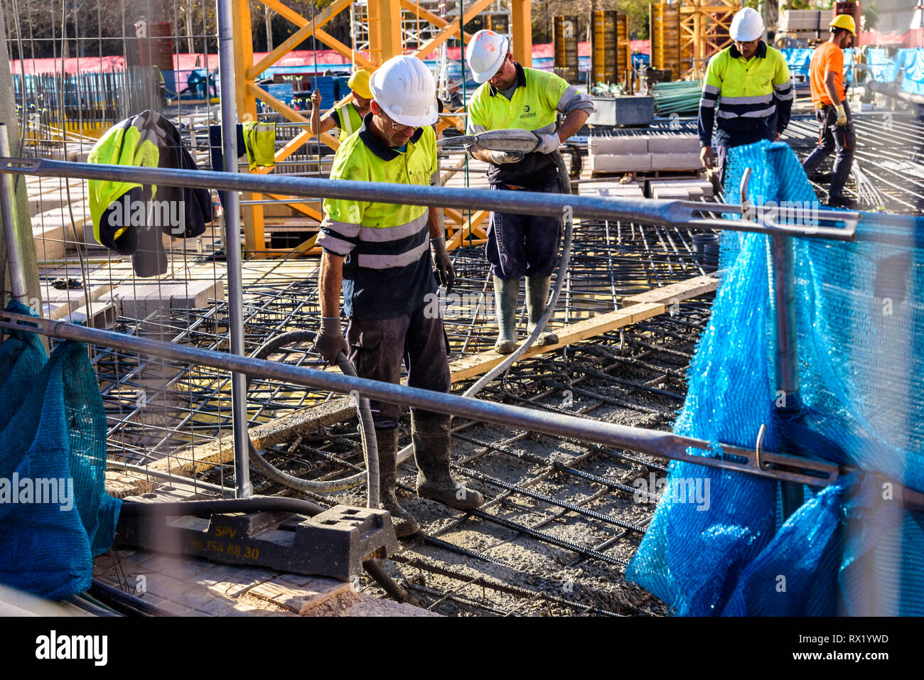 Valencia, Spain - February 28, 2019: Workers working on the foundations ...