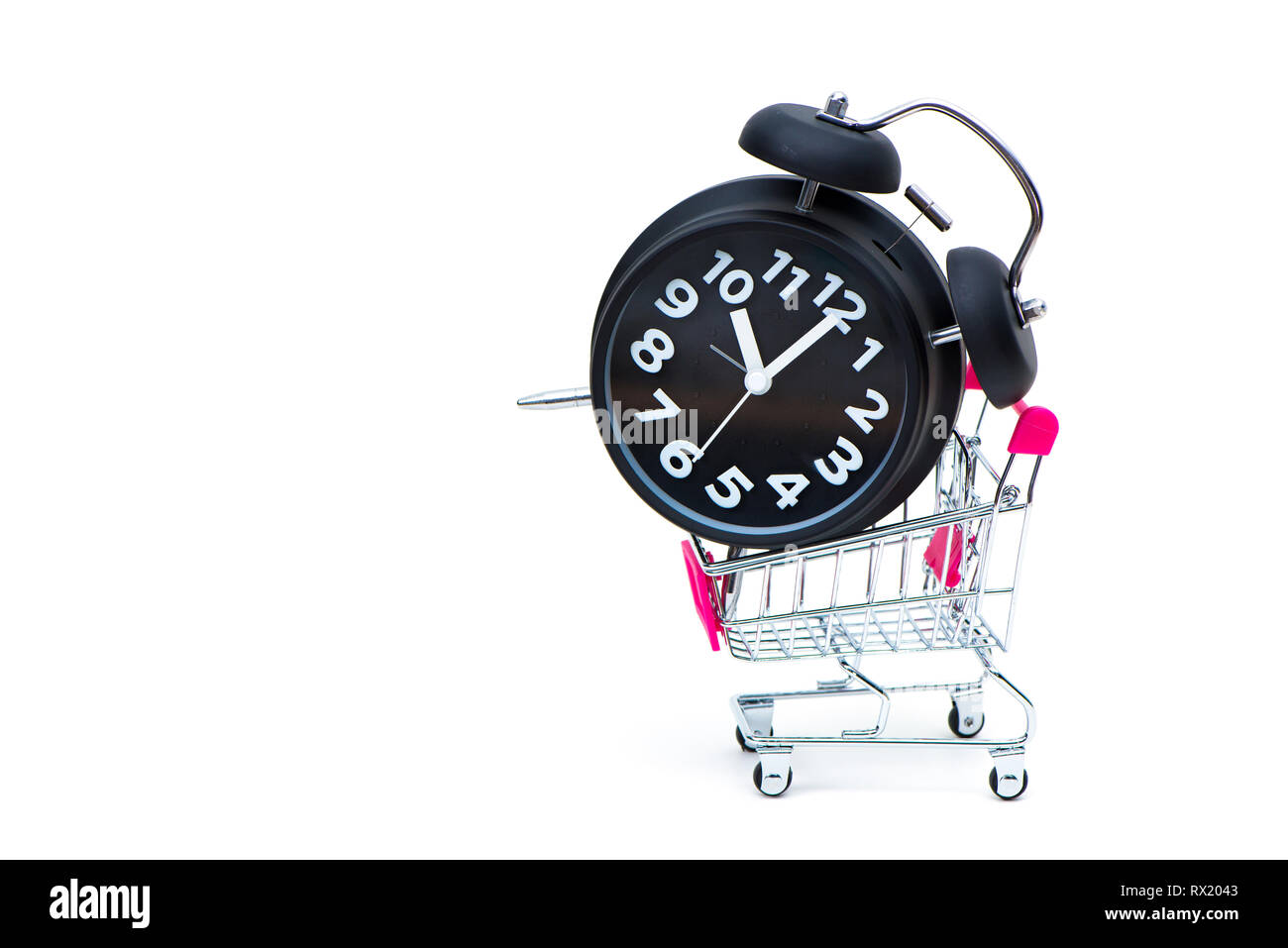 Black vintage alarm clock and shopping cart or supermarket trolley ...