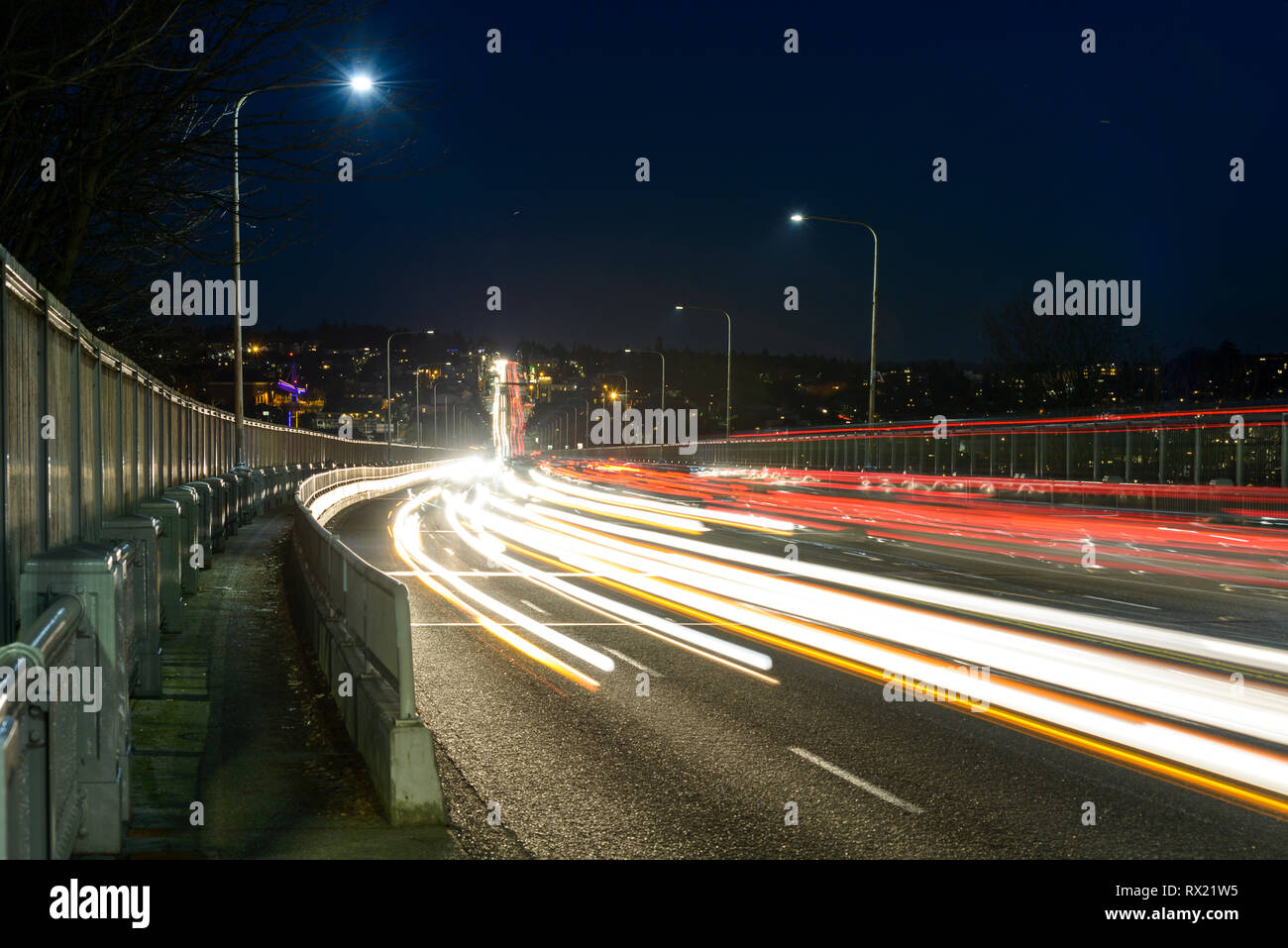 Light trails on bridge against sky at night Stock Photo - Alamy