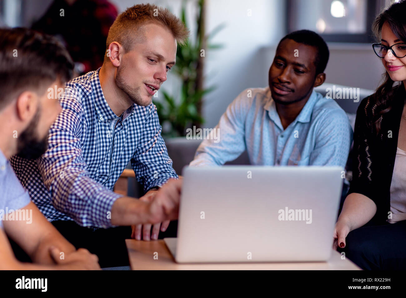 Teamwork concept.Young creative coworkers working with new startup ...