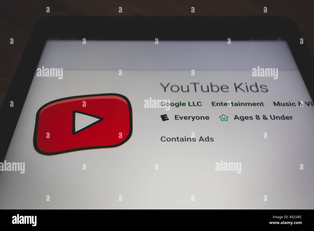 YouTube Kids app logo on Google Play store is shown on tablet screen ...