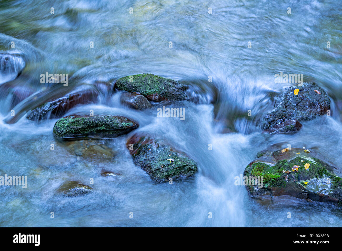 Water Rushing Over Rocks Stock Photo - Alamy