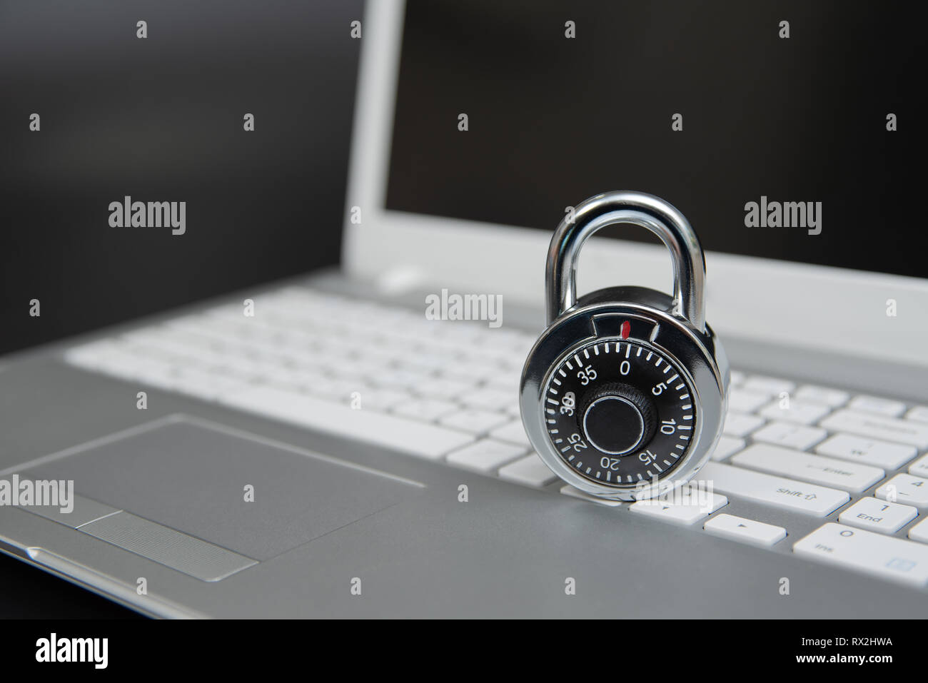 Computer security concept, padlock on laptop keyboard Stock Photo - Alamy
