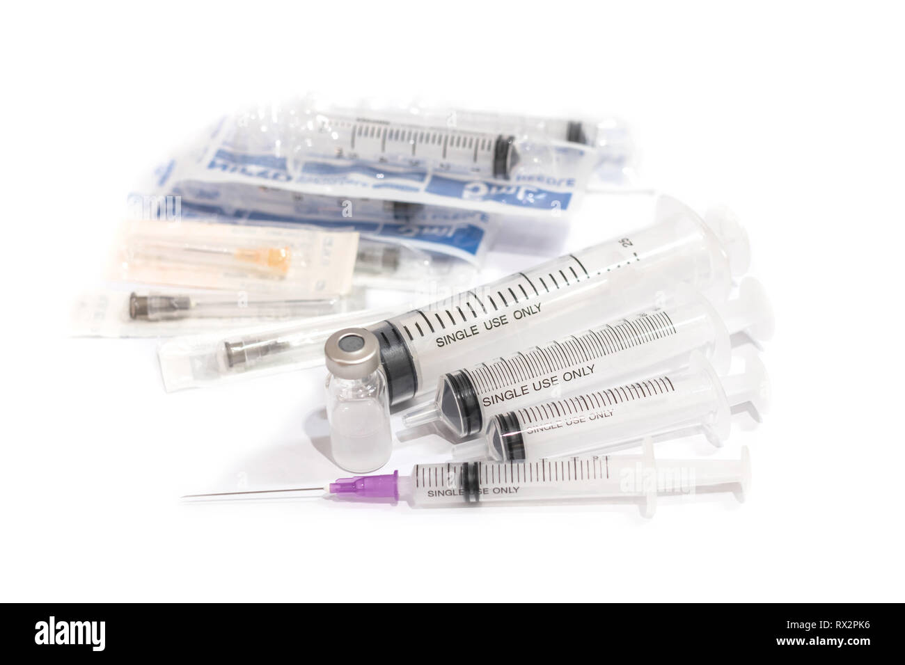 Vials with medication and injection needle isolated on white background ...