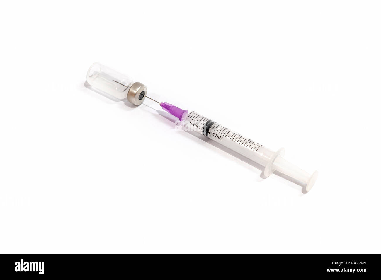 Vials with medication and injection needle isolated on white background ...