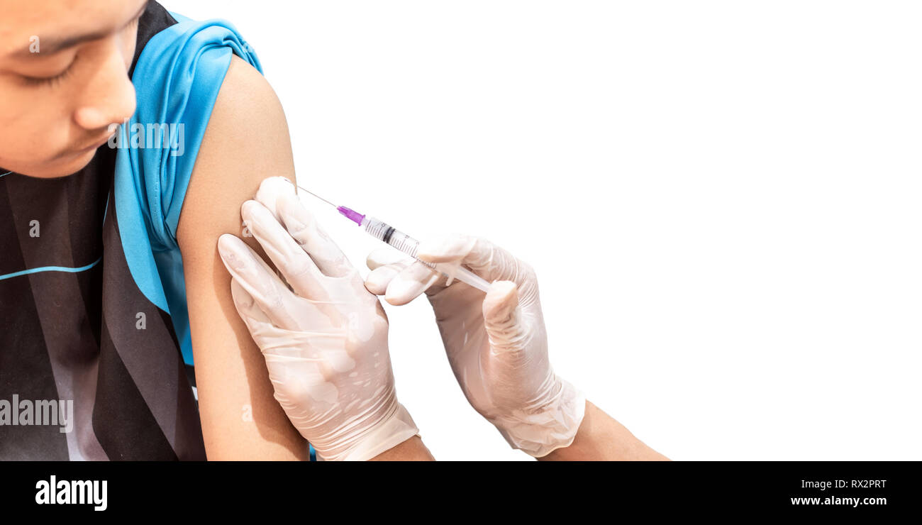 Doctor holding syringe and cotton ball to prepare injections for ...