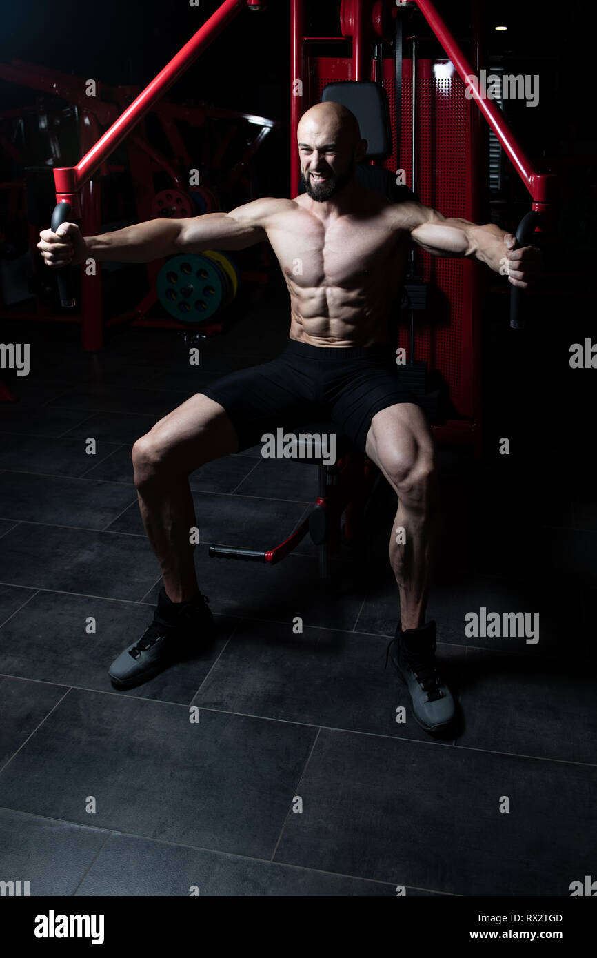 Handsome Muscular Fitness Bodybuilder Doing Heavy Weight Exercise For ...