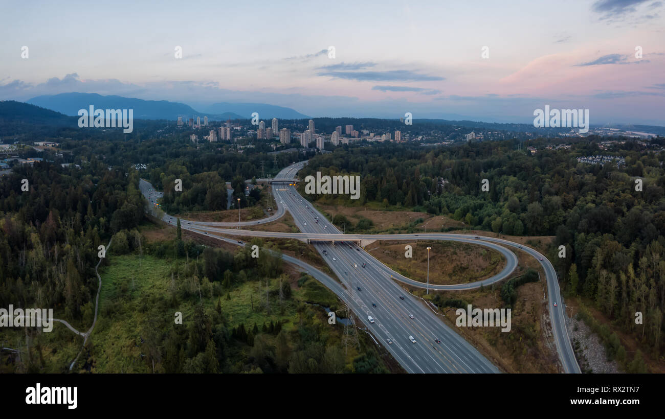 Aerial panoramic view of a highway entrance and exit in the modern city ...