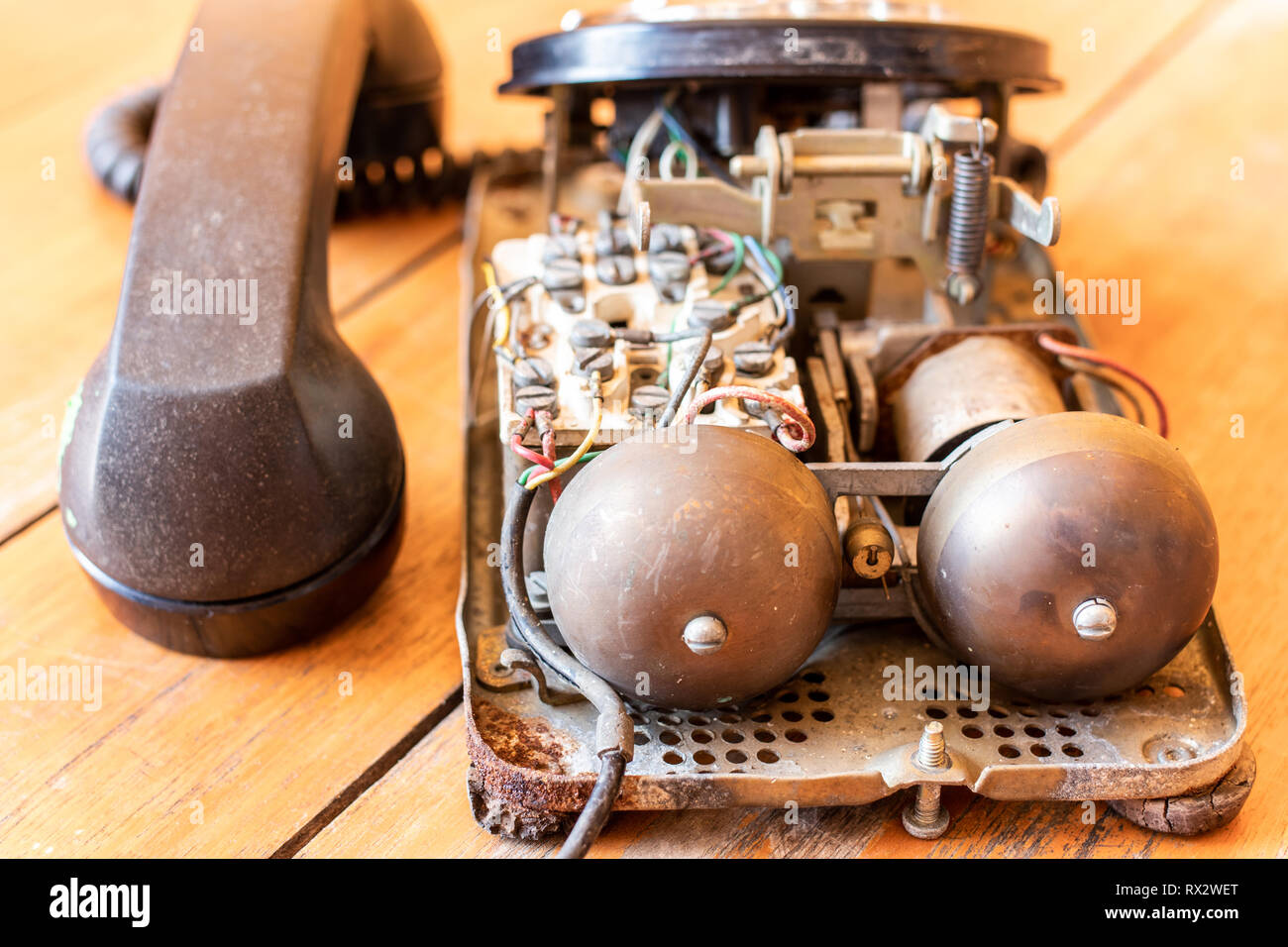 Inside old telephone receiver on wooden table background Stock Photo ...
