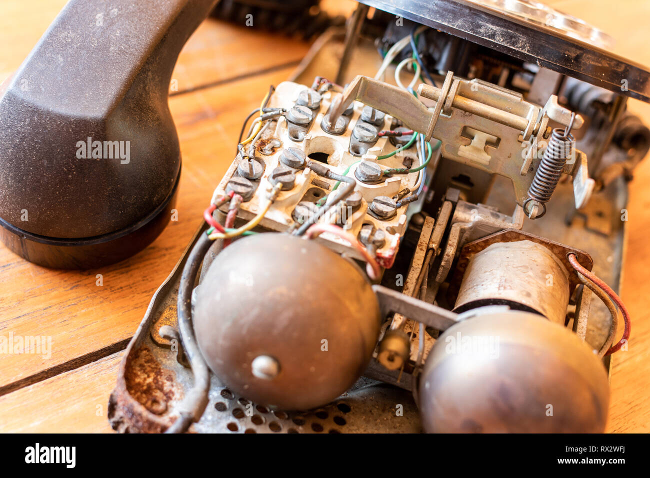 Inside old telephone receiver on wooden table background Stock Photo ...