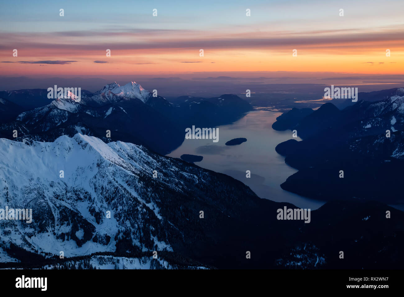 Aerial view of Canadian Mountain Landscape during a vibrant sunset ...
