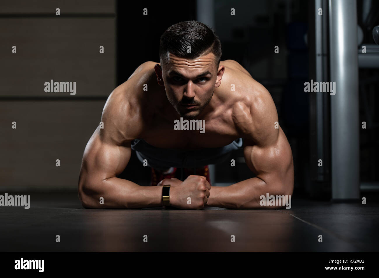Young Athlete Doing Pushups As Part Of Bodybuilding Training Stock ...