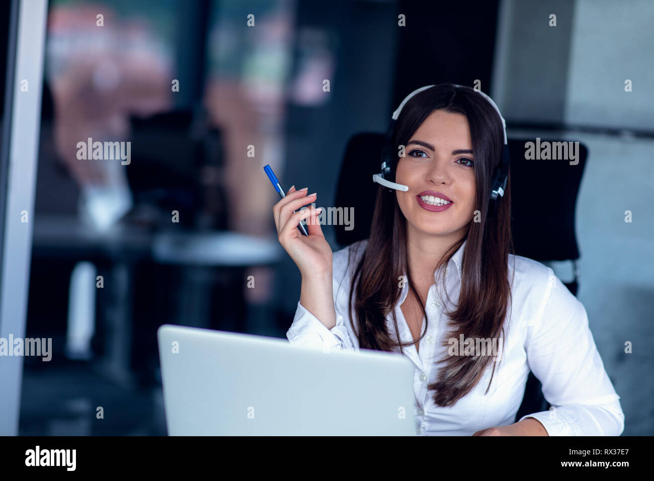 Portrait of happy smiling female customer support phone operator at workplace Stock Photo - Alamy