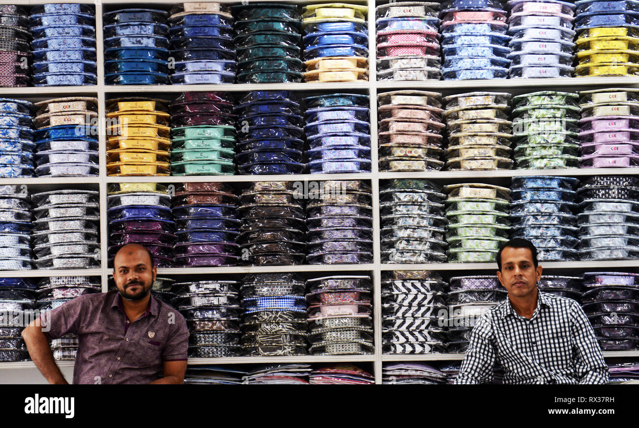 Bangladeshi garment shops in buildings along the Buriganga River in ...