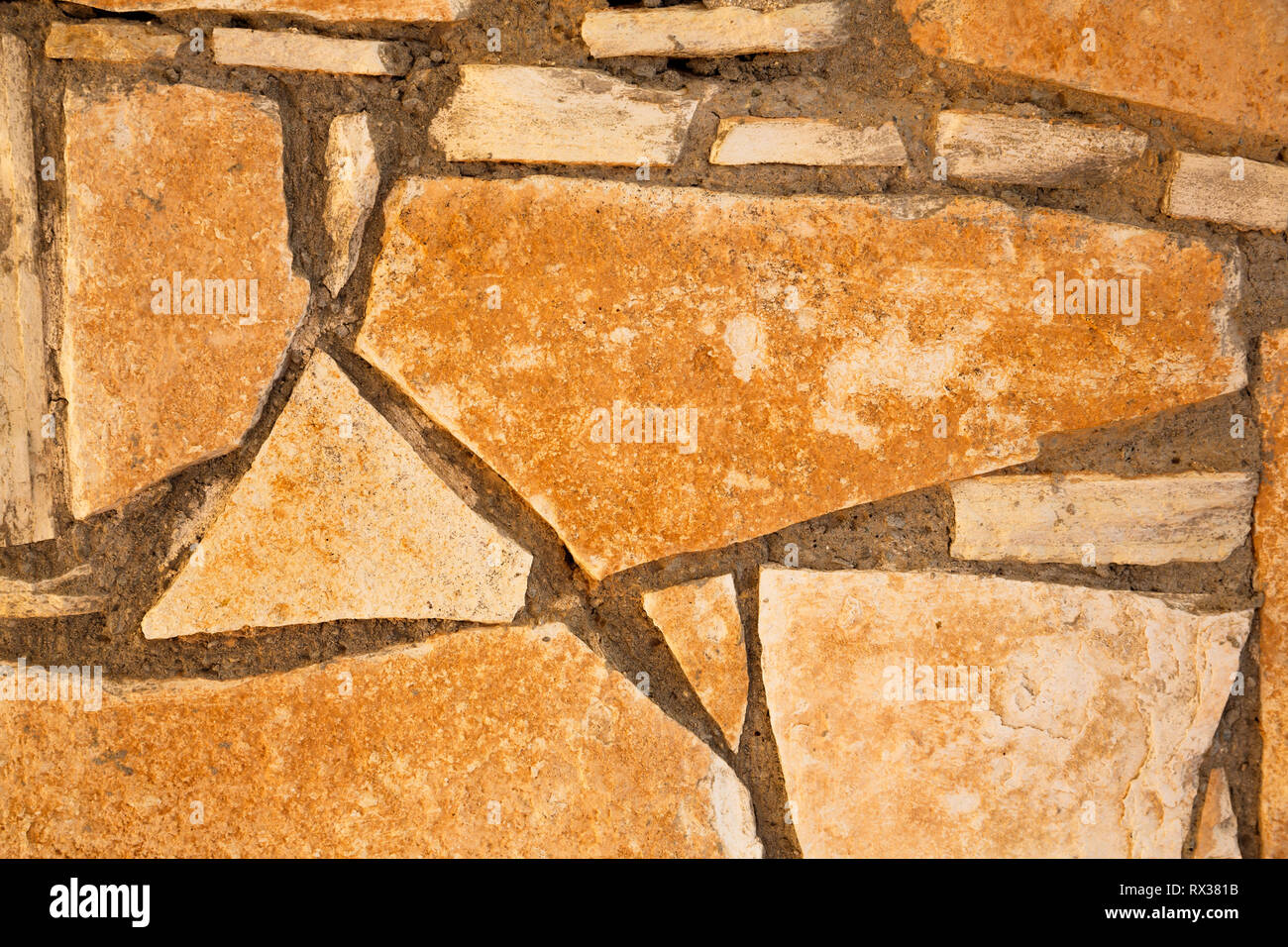 Modern wall background with different size stones Stock Photo - Alamy