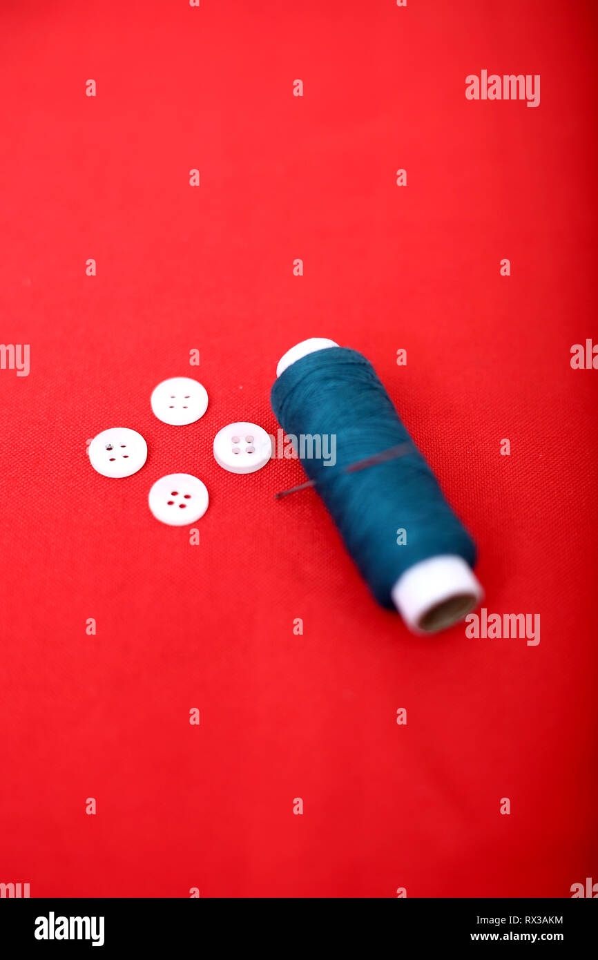 Picture of one sewing thread with needle and button. Isolated on the ...