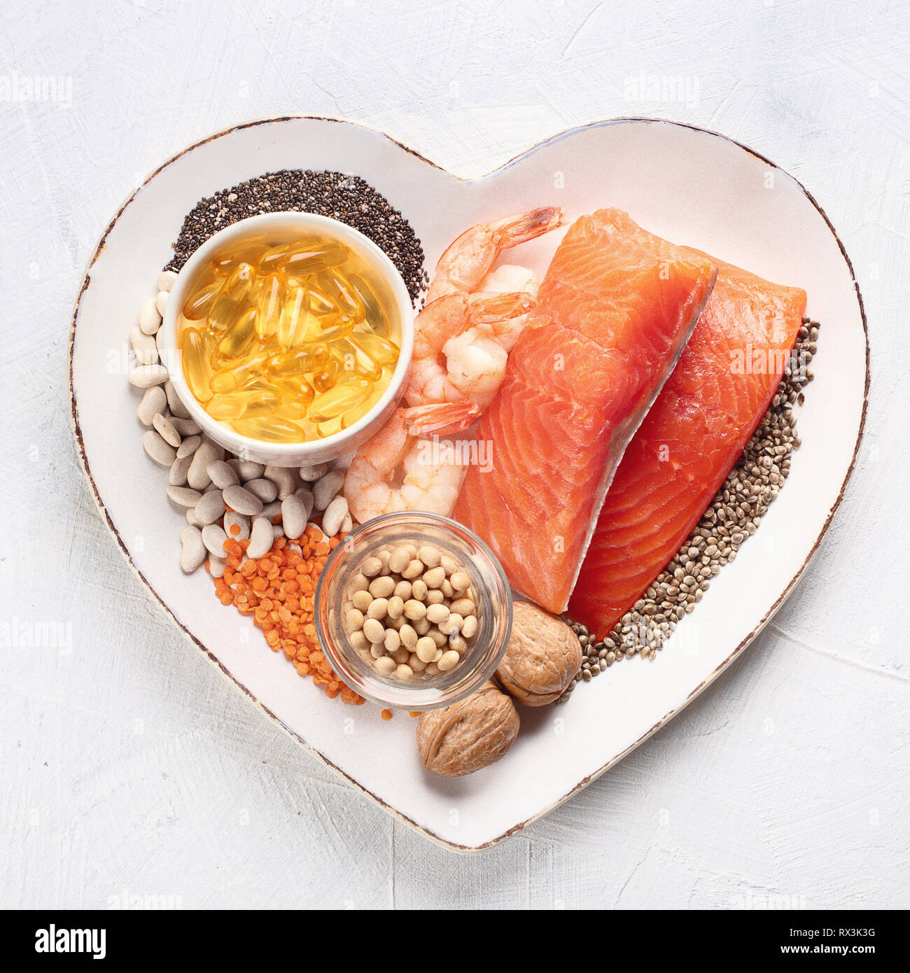 Sources of omega 3 in heart shape plate. Healthy diet food concept. Top ...