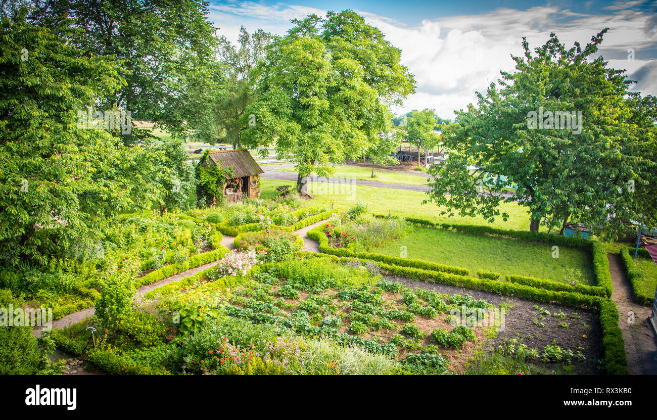 a pretty garden house in a dreamlike idyll Stock Photo - Alamy