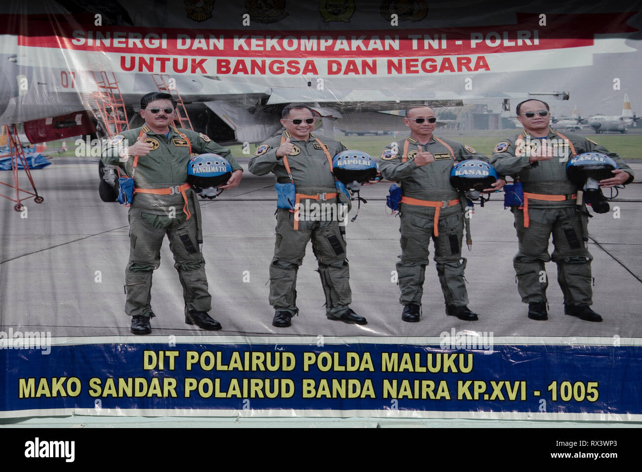 Poster promoting unity with police and armed forces, Banda Naira, near ...