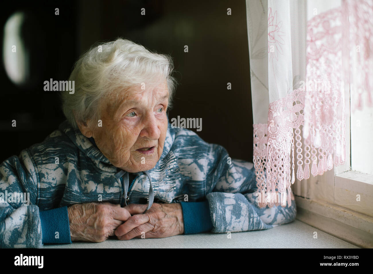 Grandma looking out window hi-res stock photography and images - Alamy