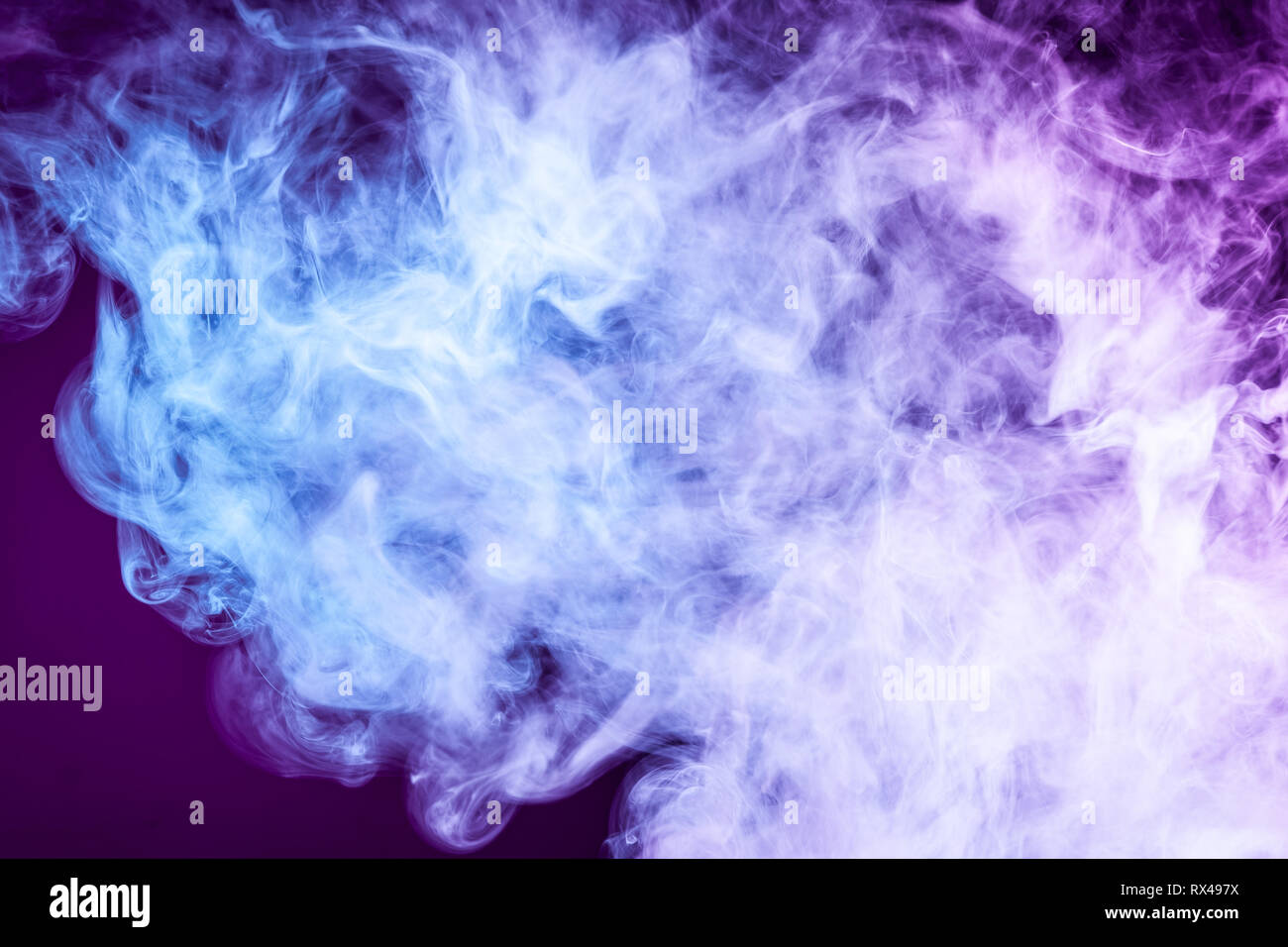 Frozen abstract movement of explosion smoke multiple pink and blue neon ...
