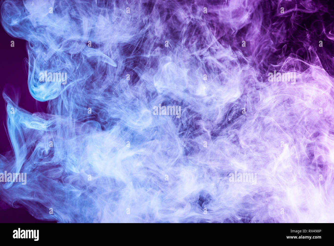 Frozen abstract movement of explosion smoke multiple pink and blue neon ...