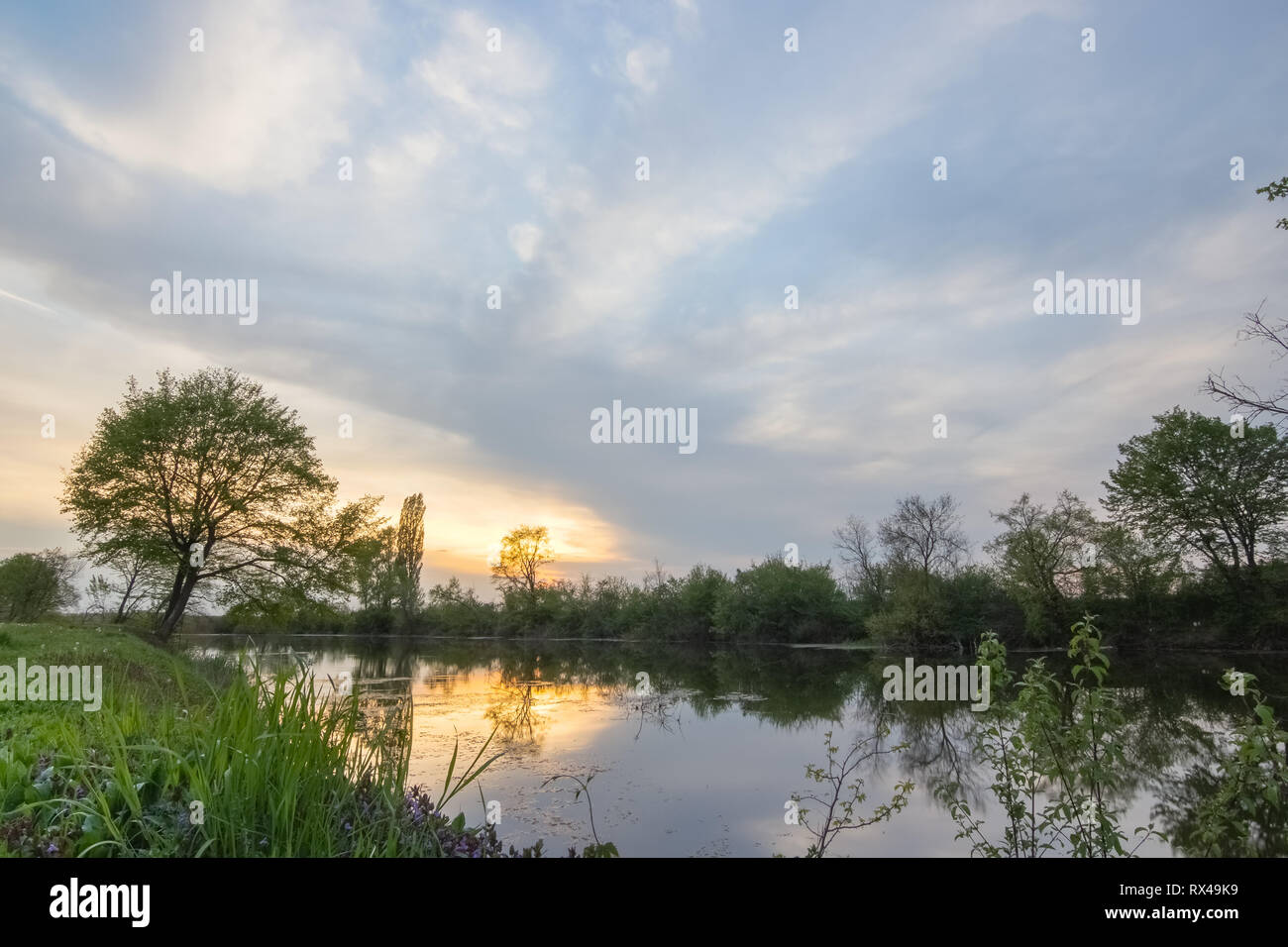 Colorful sunset over calm river Bosut, Vinkovci, Croatia Stock Photo ...