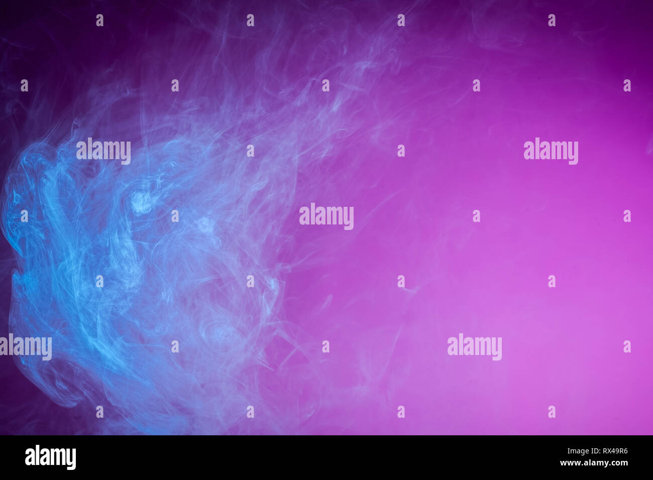 Colorful blue smoke on a pink isolated background. Background from the ...