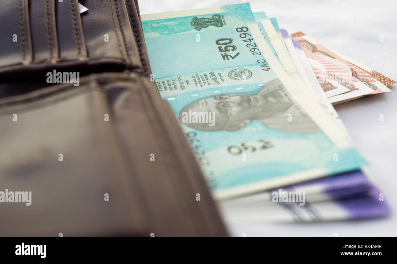 Colseup of Indian currency coming out of his pocket Stock Photo - Alamy