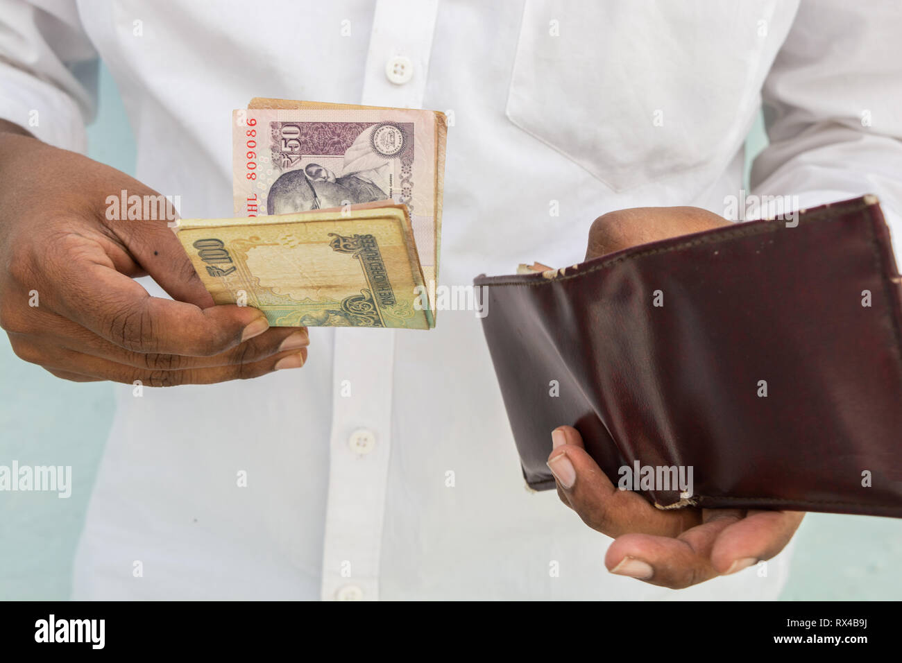 Taking money out of wallet hi-res stock photography and images - Alamy