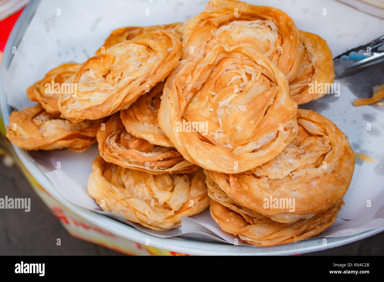 Stack of fried crispy roti at street food, thai style Stock Photo - Alamy
