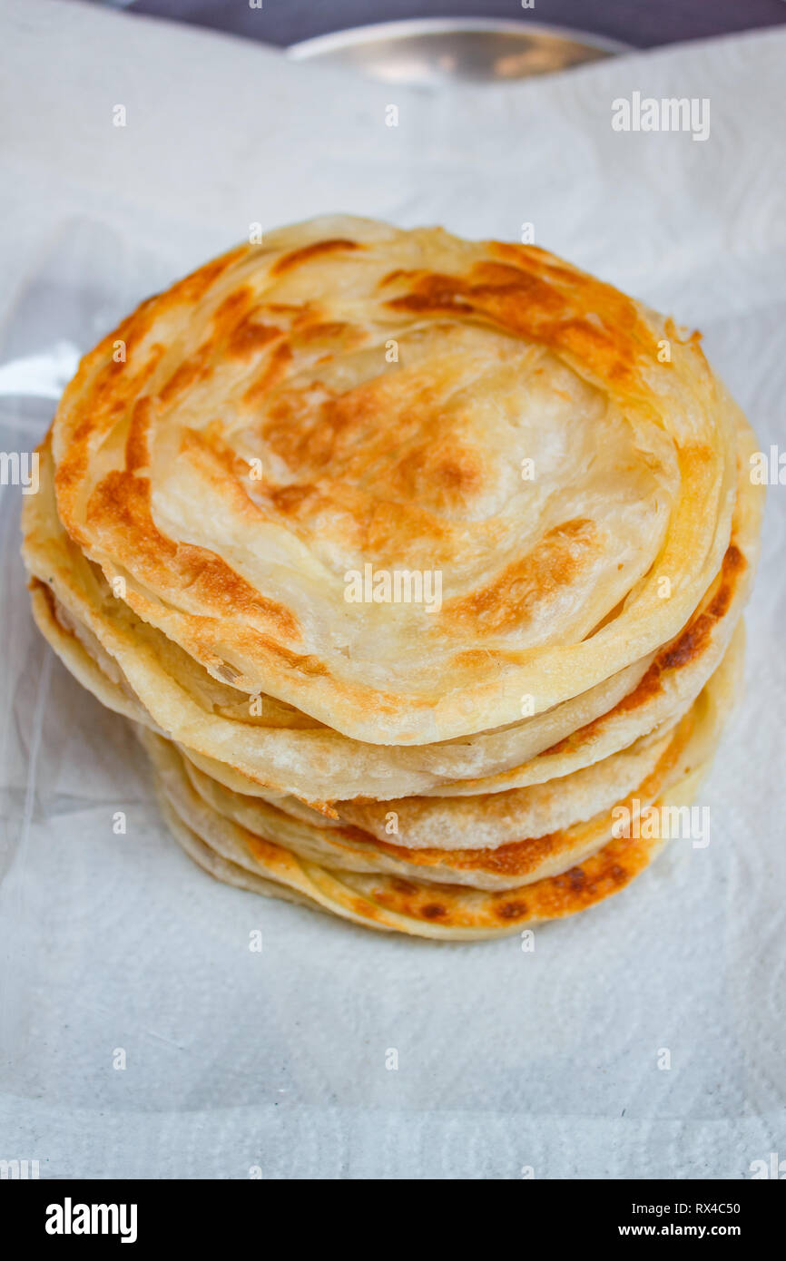 Stack of fried crispy roti at street food, thai style Stock Photo - Alamy