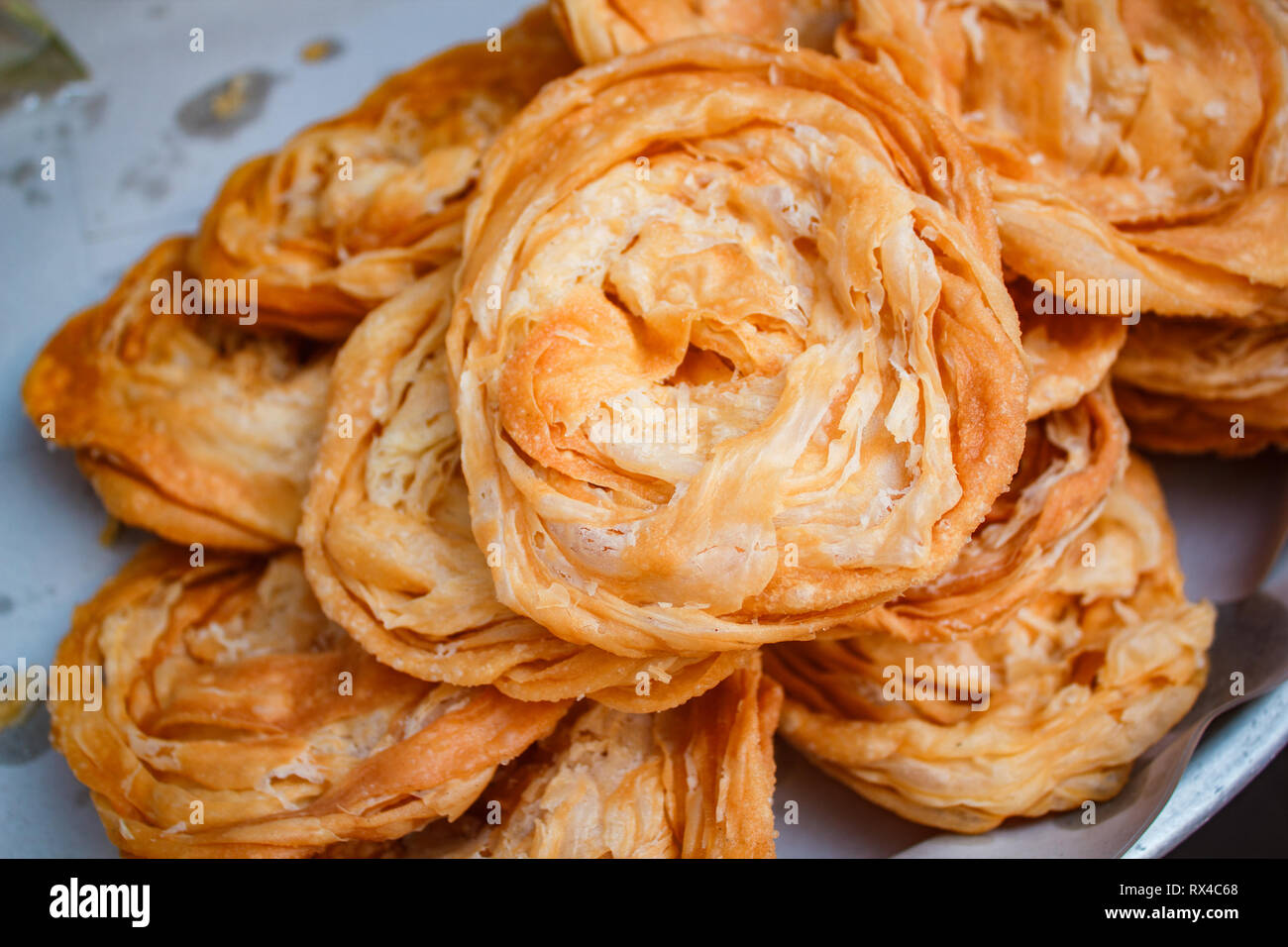 Stack of fried crispy roti at street food, thai style Stock Photo - Alamy