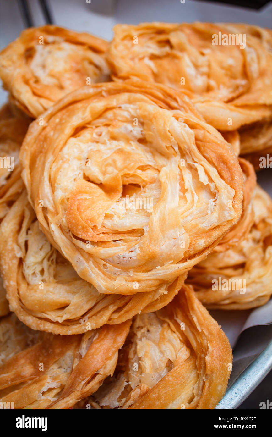 Stack of fried crispy roti at street food, thai style Stock Photo - Alamy